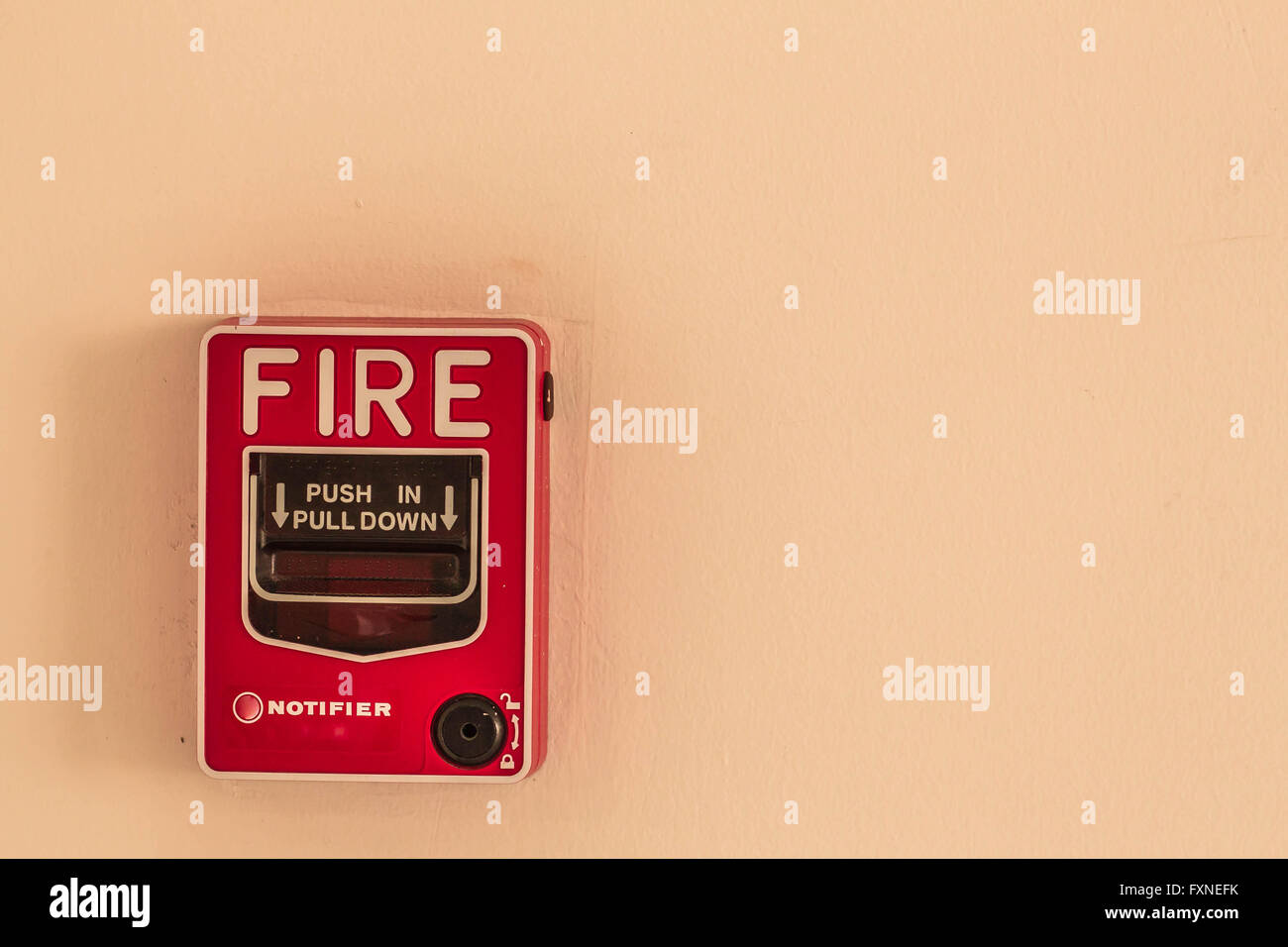 Alarm button to alert the fire Stock Photo - Alamy