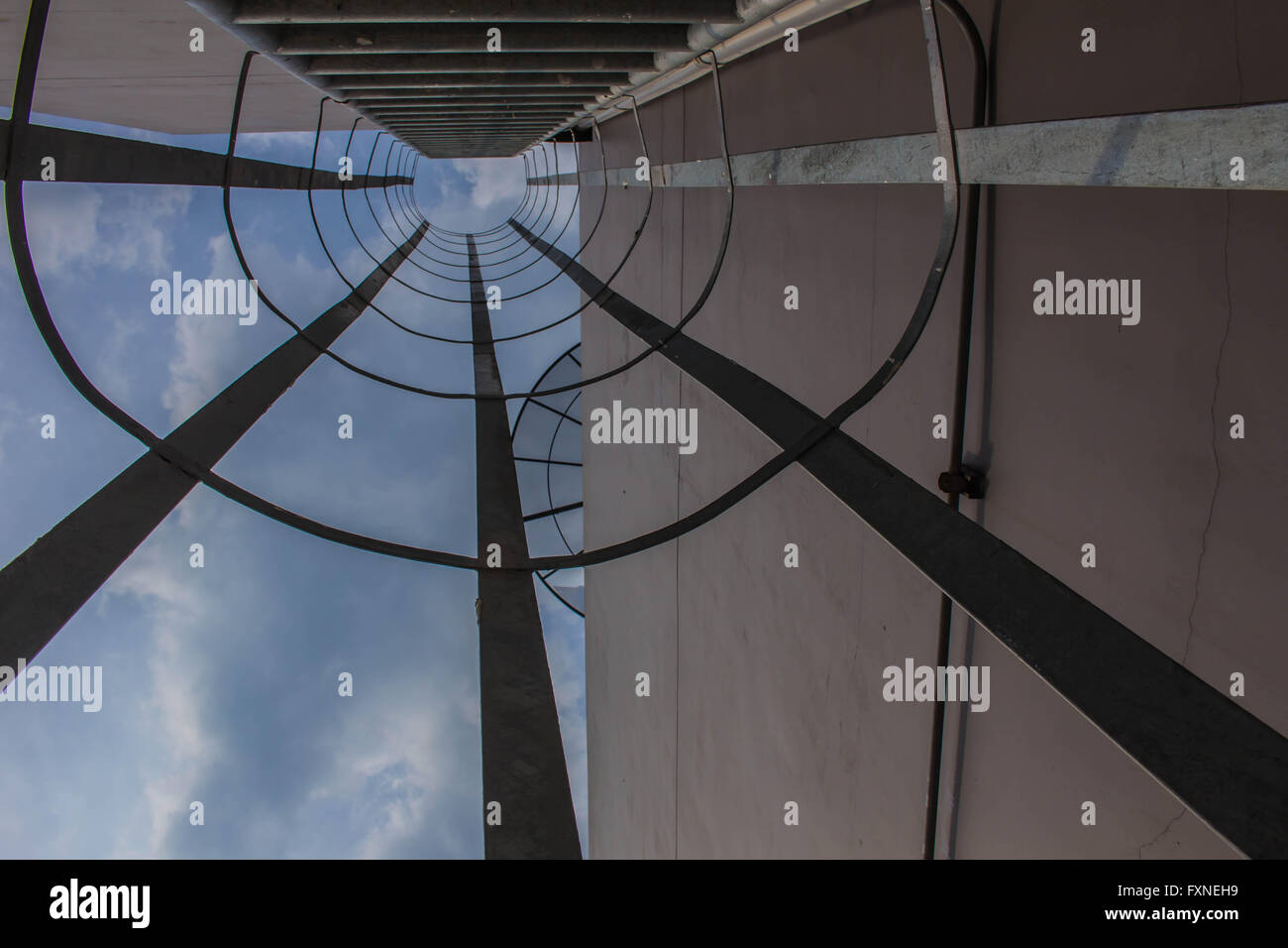 Ladder on the roof of a tall building with a view to returning from the ...