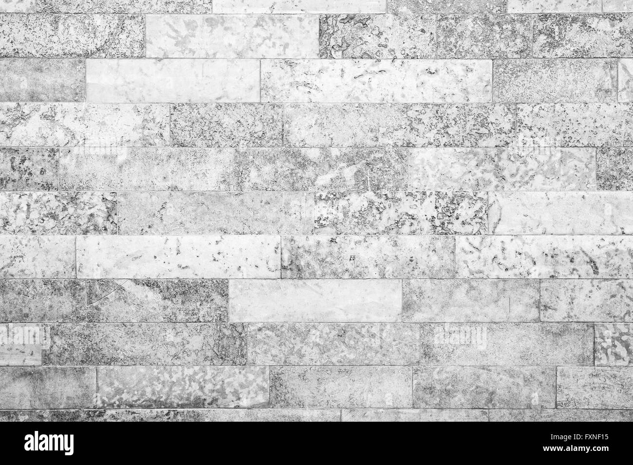 Background photo texture of gray stone wall with decorative tiling ...