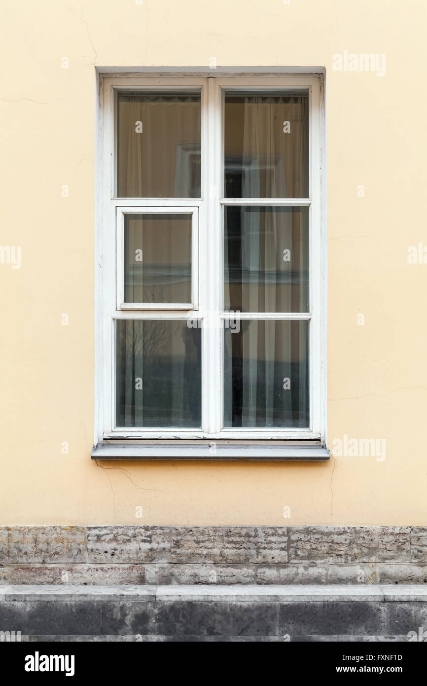 Classical architecture details, yellow wall and window in white frame ...