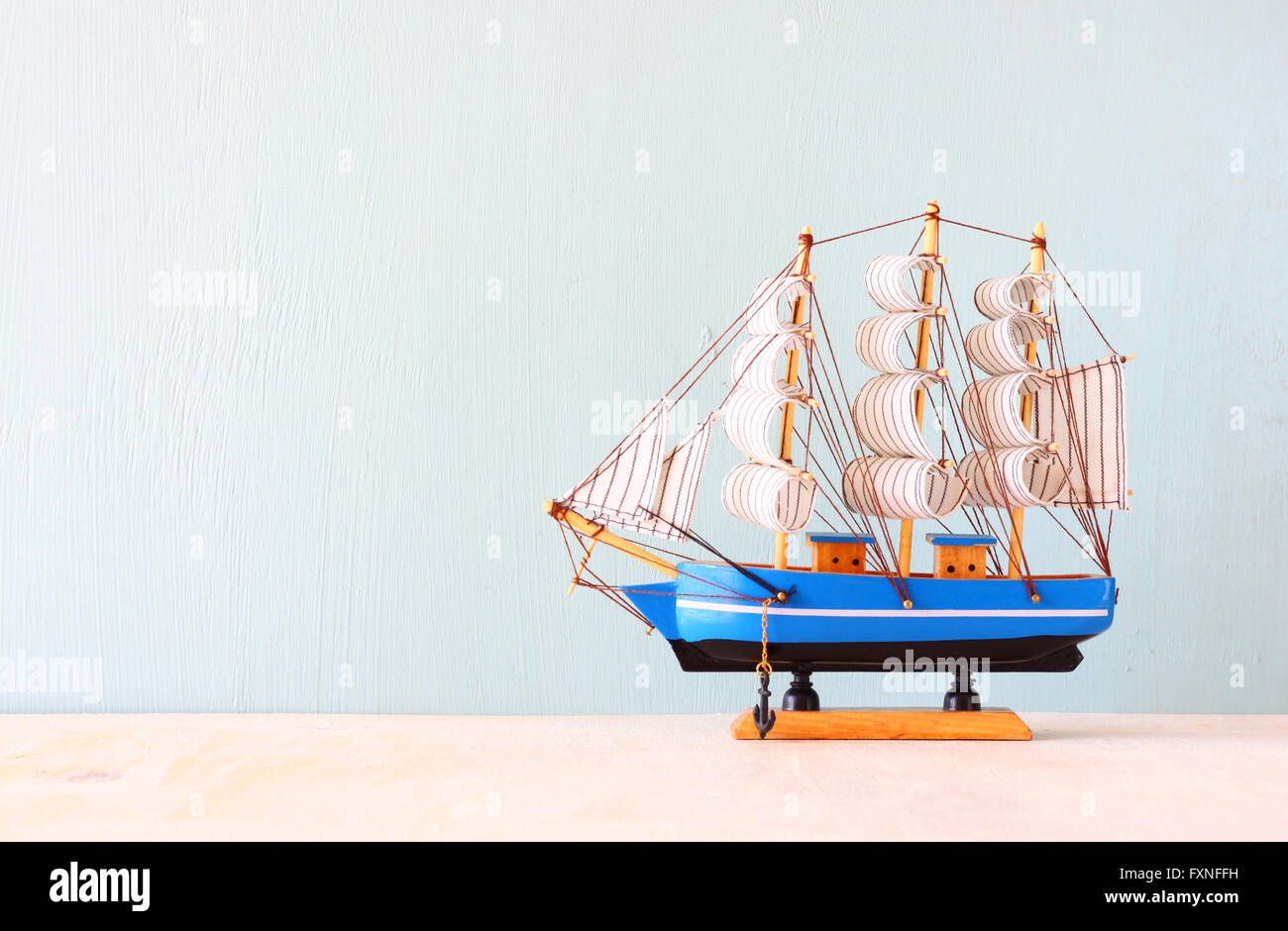 wooden boat over wooden textured background. filtered image Stock Photo ...