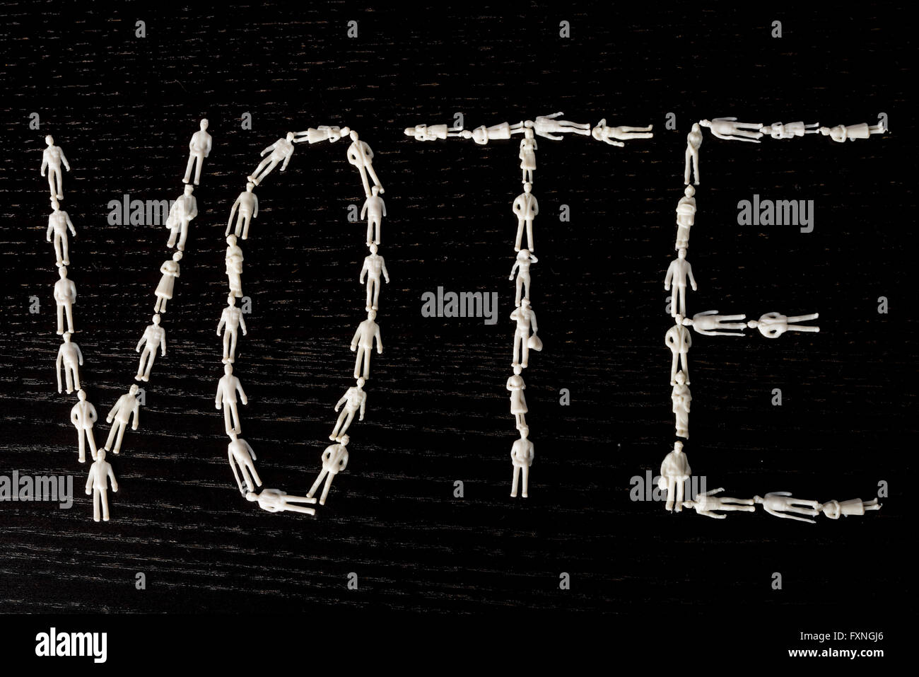 Vote sign made of white people figures Stock Photo - Alamy