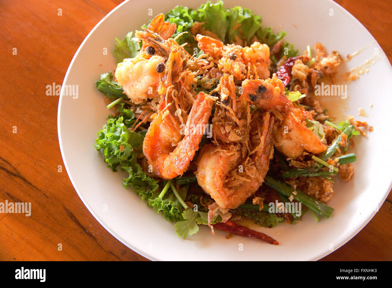 Fried Shrimp with tamarind sauce.Thai food on wooden table Stock Photo ...