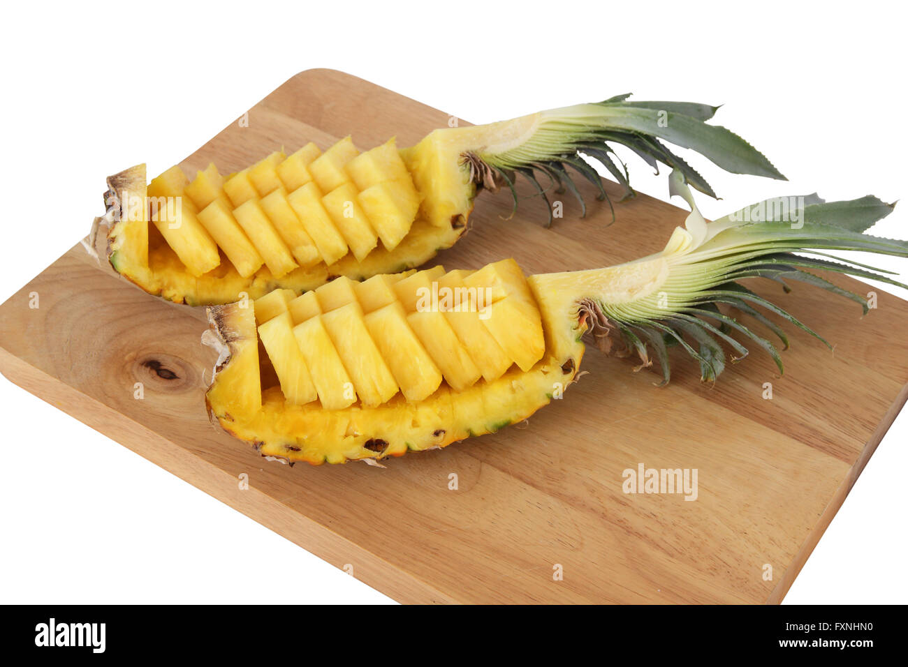 Put sliced pineapple in its own shell. on wood splat Stock Photo - Alamy