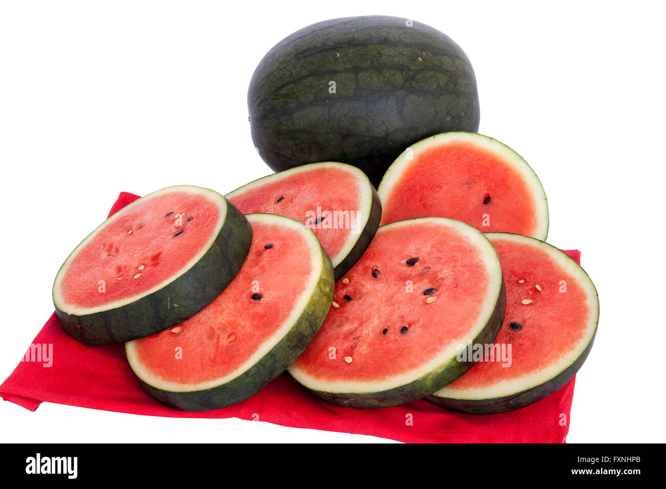 The watermelon and cut into split on a red cloth Stock Photo - Alamy