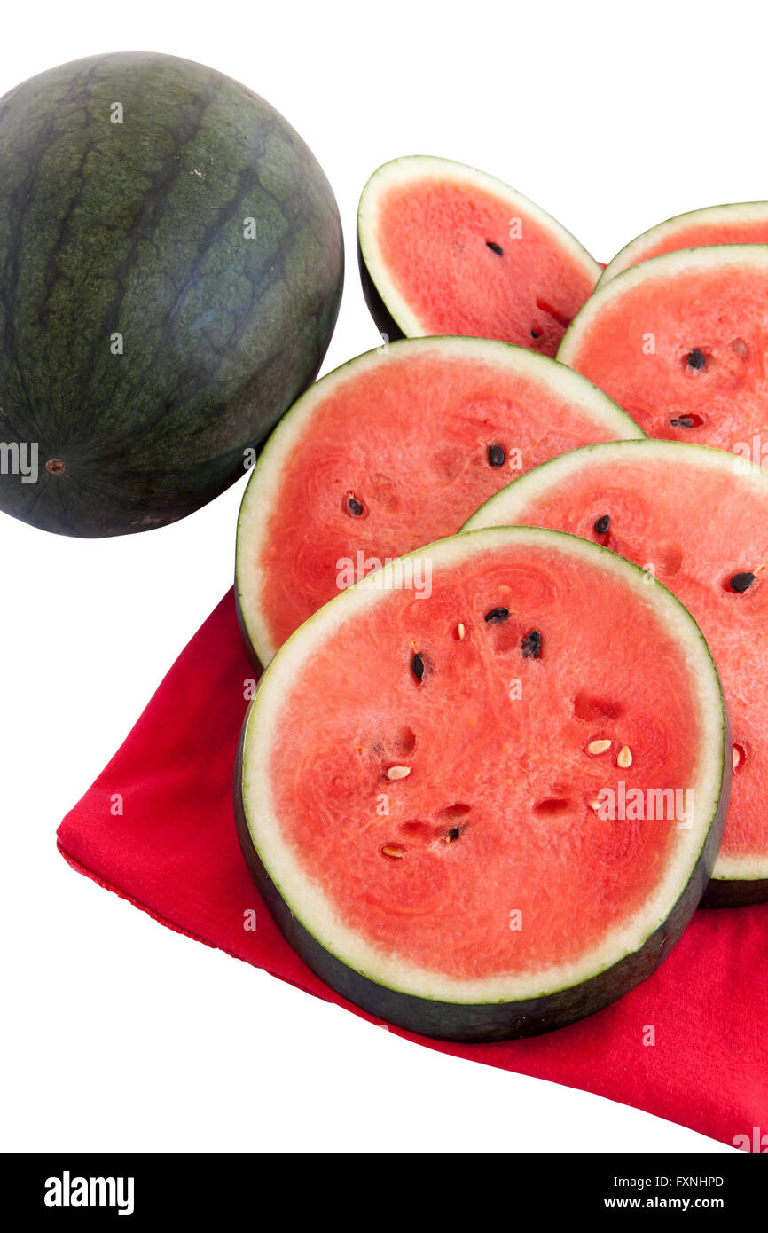 The watermelon and cut into split on a red cloth Stock Photo - Alamy