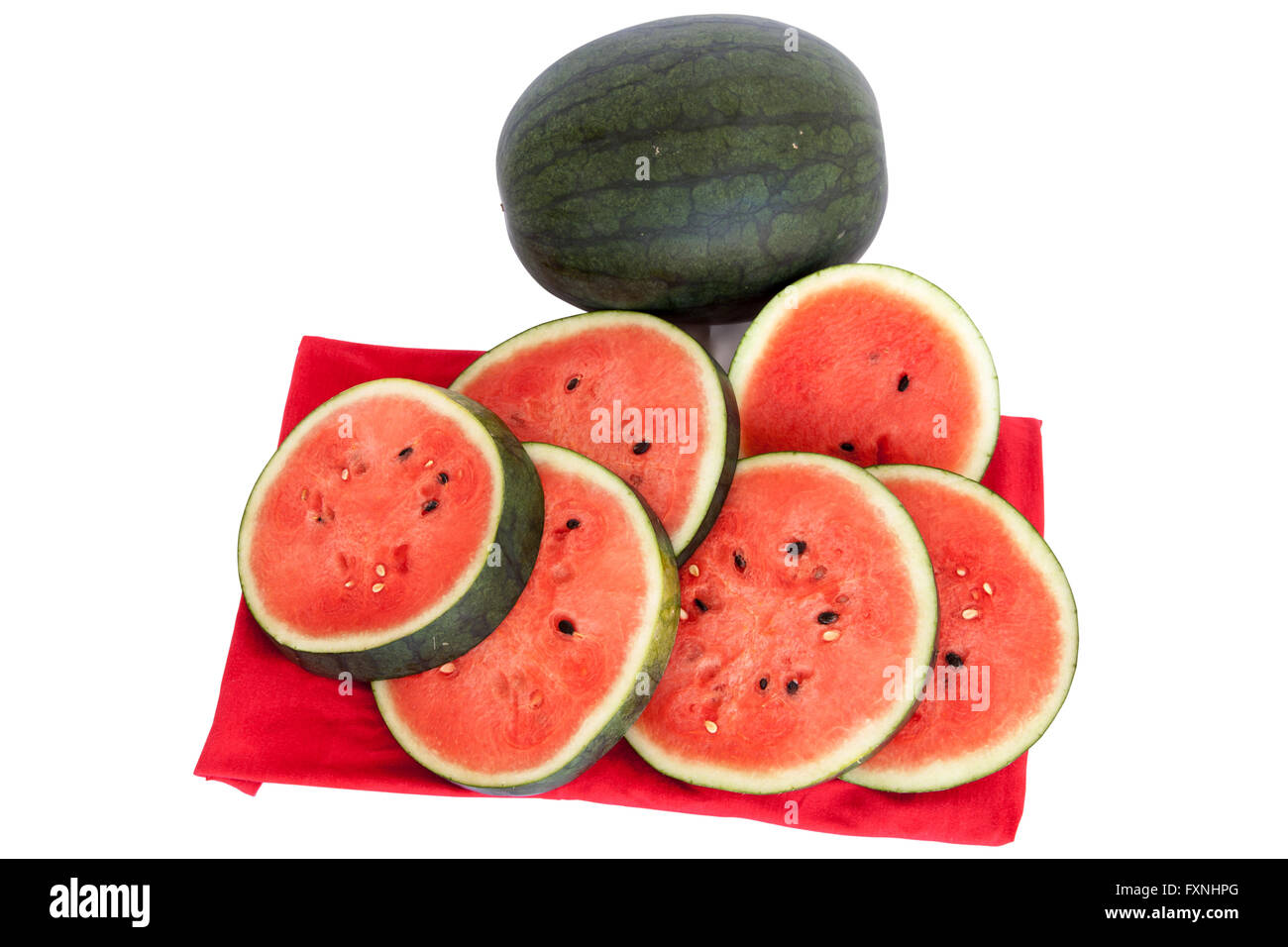 The watermelon and cut into split on a red cloth Stock Photo - Alamy