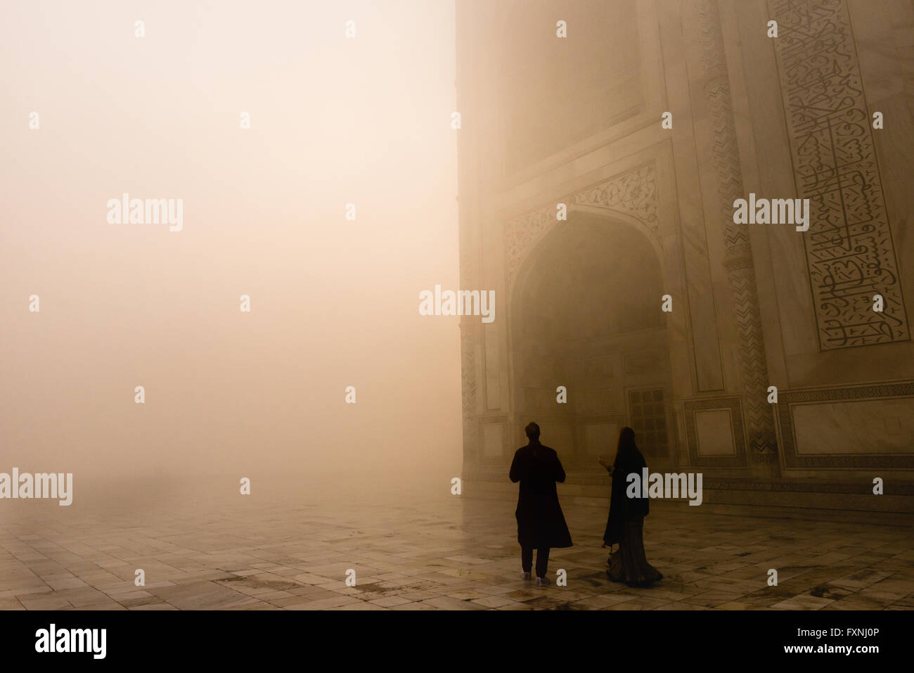 Figures in fog at Taj Mahal, India Stock Photo - Alamy