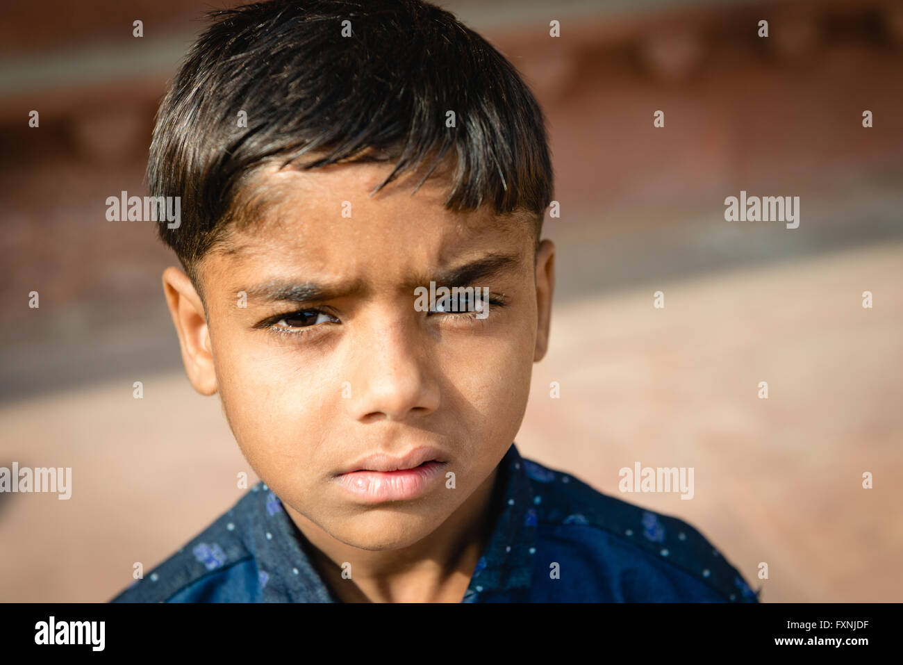 Young Indian boy poses for photograph Stock Photo - Alamy