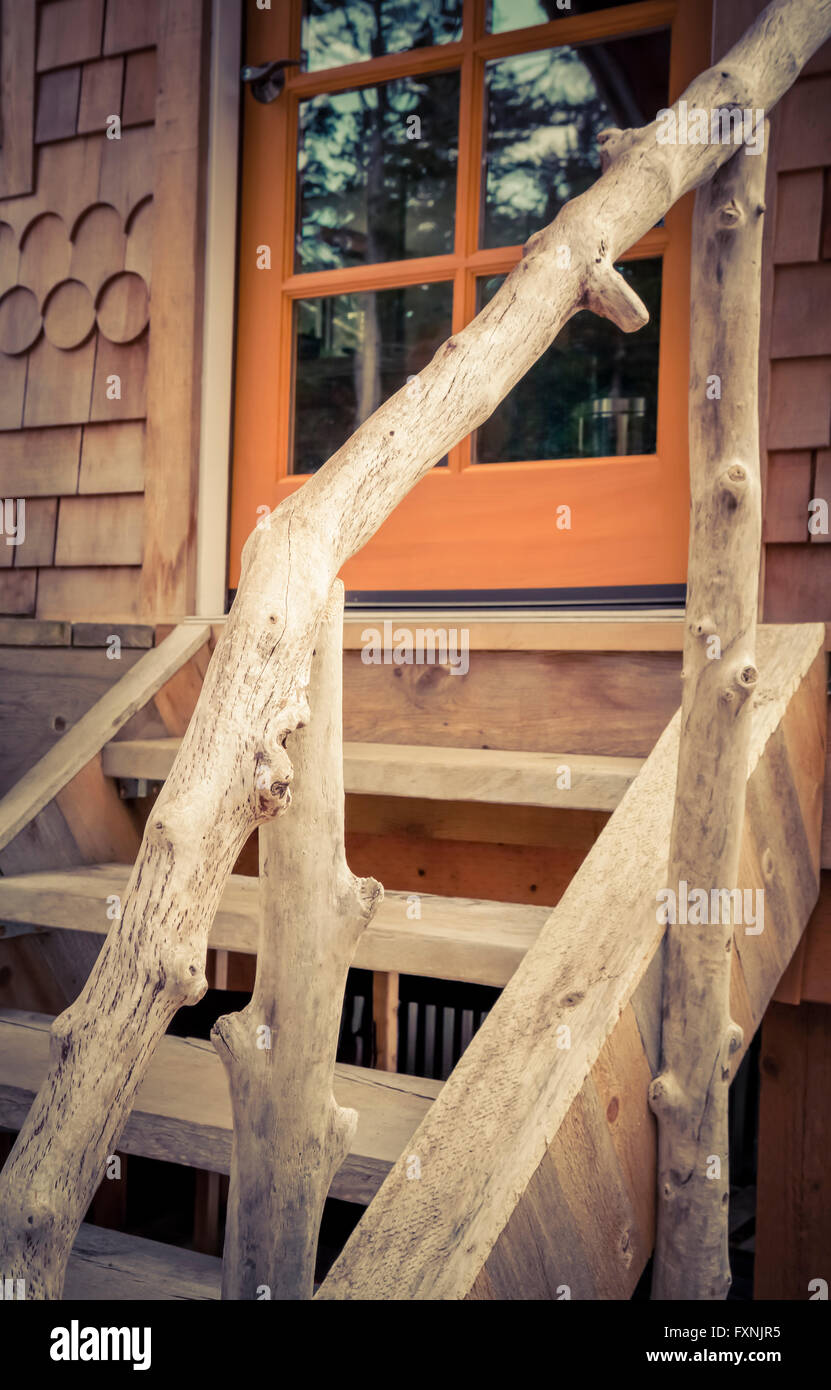 Rustic entry to a house with driftwood railing leading to a door Stock ...