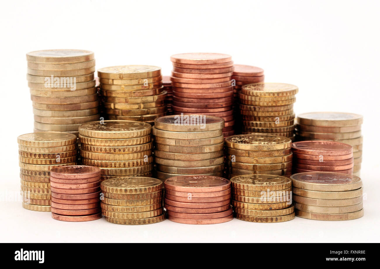 Piles of euro coins against a white background Stock Photo - Alamy
