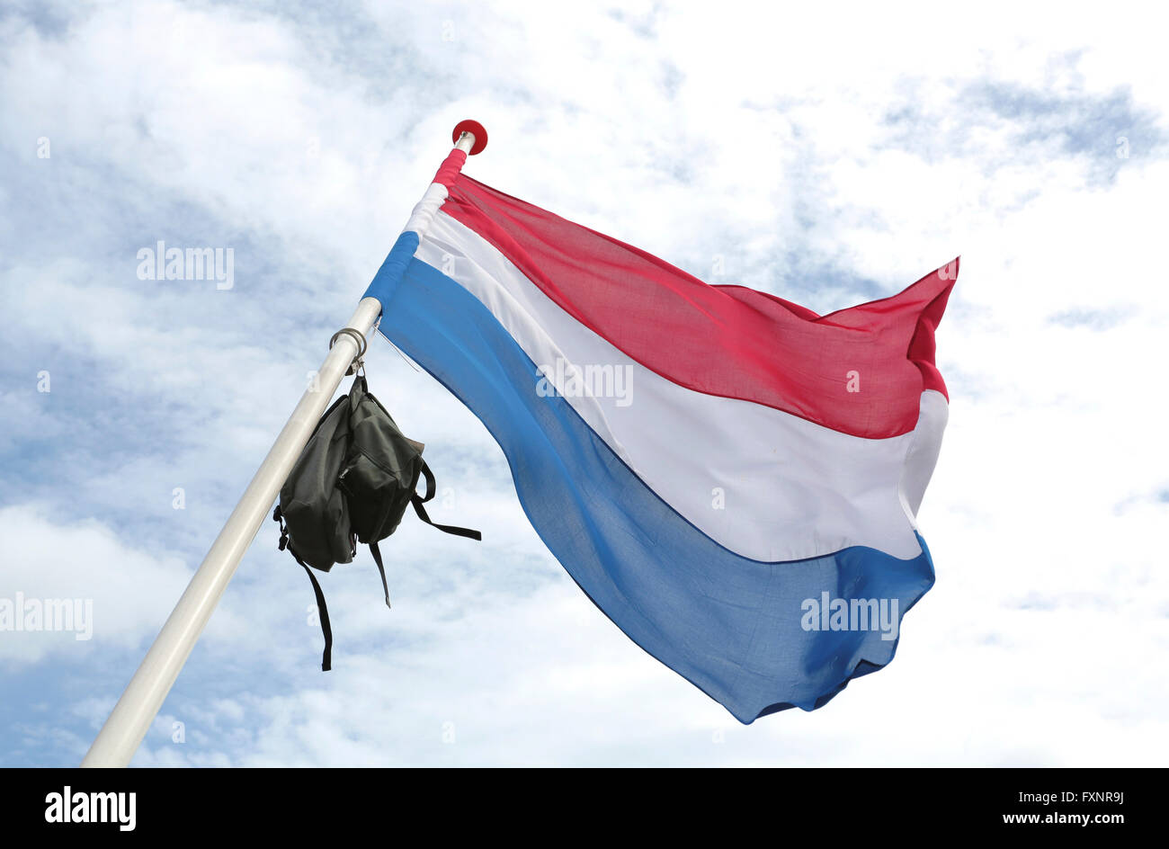 A dutch flag with a school bag in top to celebrate graduation Stock ...