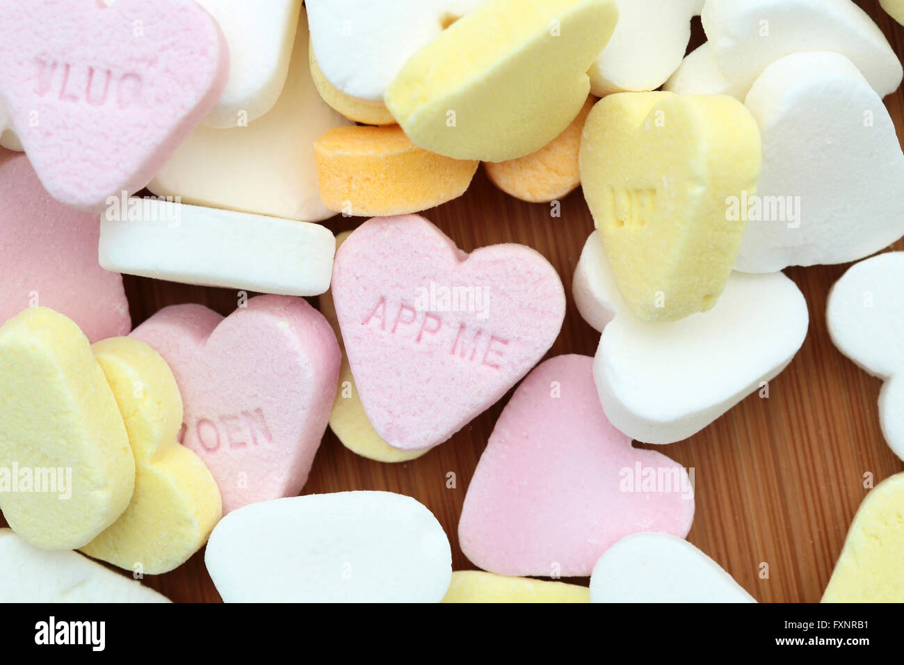 Candy hearts with the text 'app me' Stock Photo - Alamy