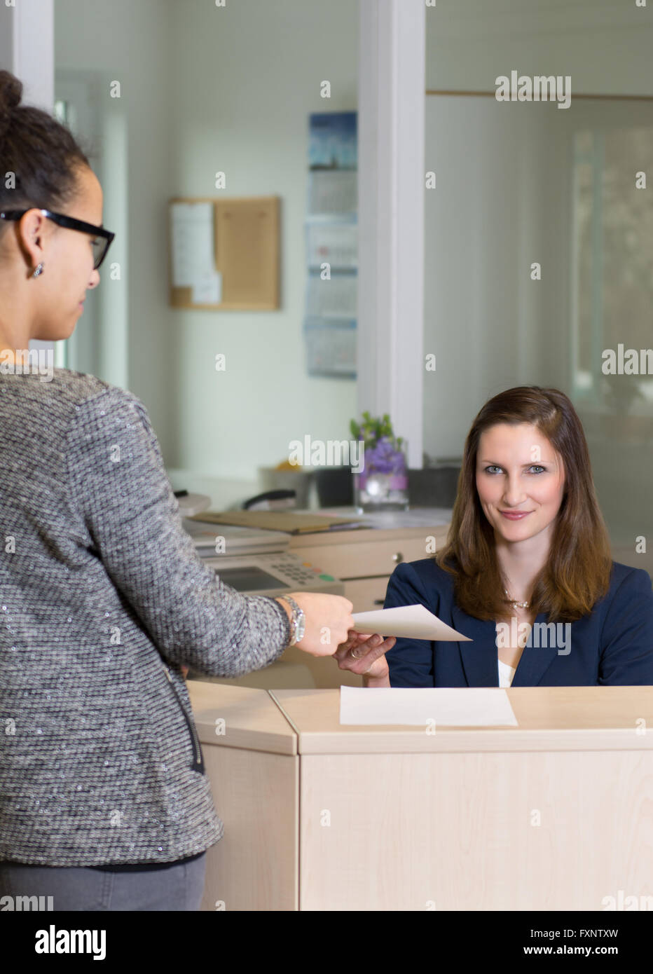 Handing over office hi-res stock photography and images - Alamy