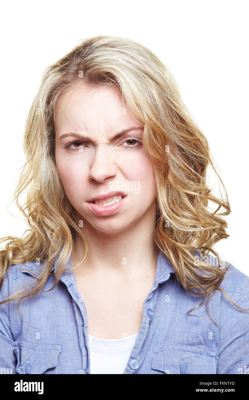 Angry blonde young woman clenching her teeth Stock Photo - Alamy