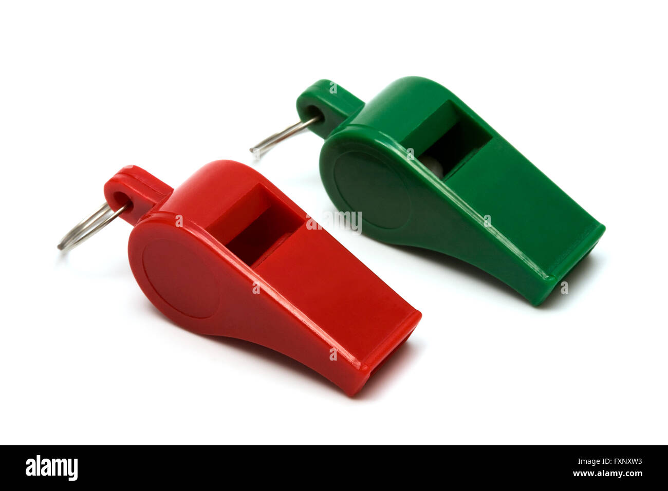 Red and green whistle on a white background Stock Photo - Alamy
