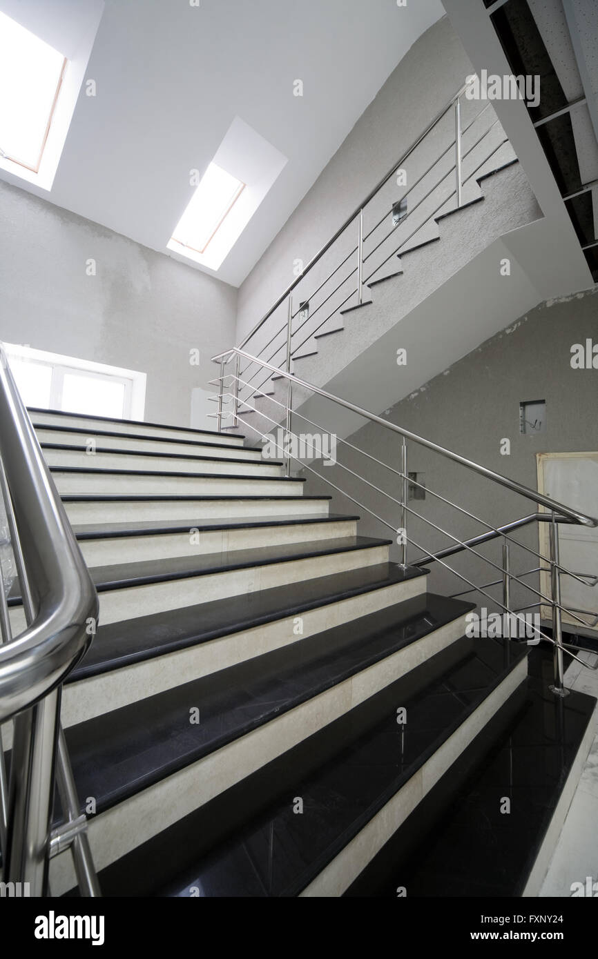 Construction of a staircase in modern office building Stock Photo - Alamy
