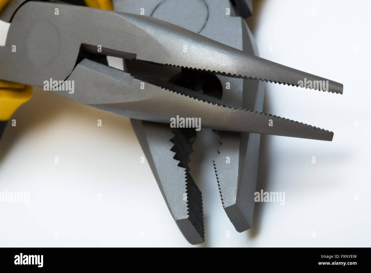 Modern and new metal flat-nose pliers close-up Stock Photo - Alamy