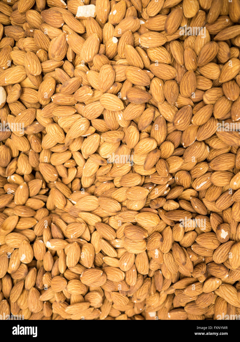 High angle close up view of almonds in a bin Stock Photo - Alamy