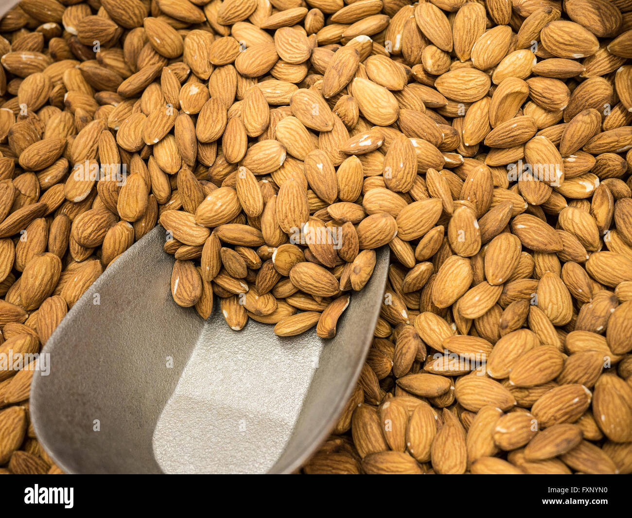 High angle close up view of almonds in a bin Stock Photo - Alamy