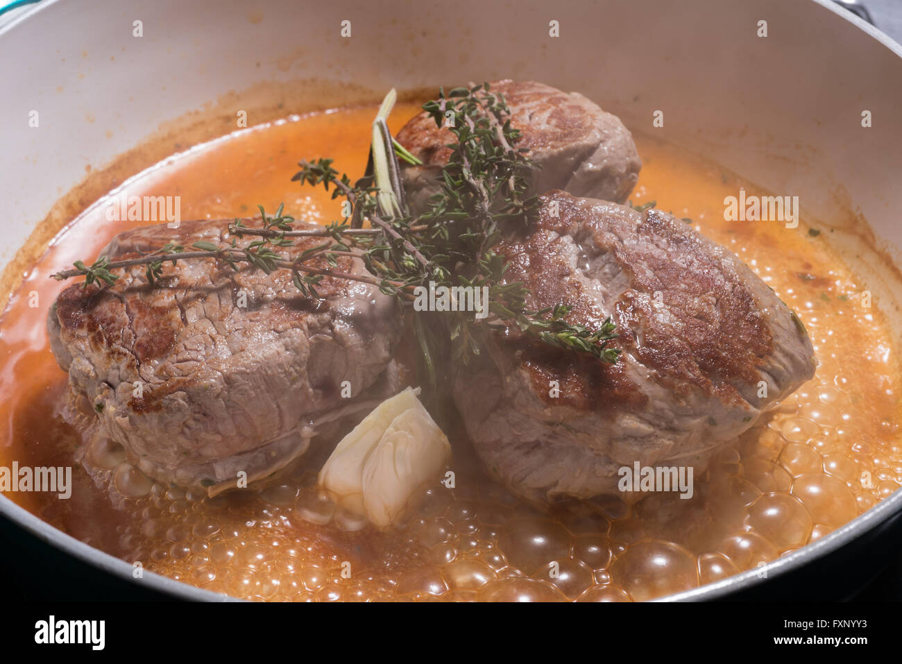 pan-fried filet of beef with rosemary and vapor Stock Photo - Alamy