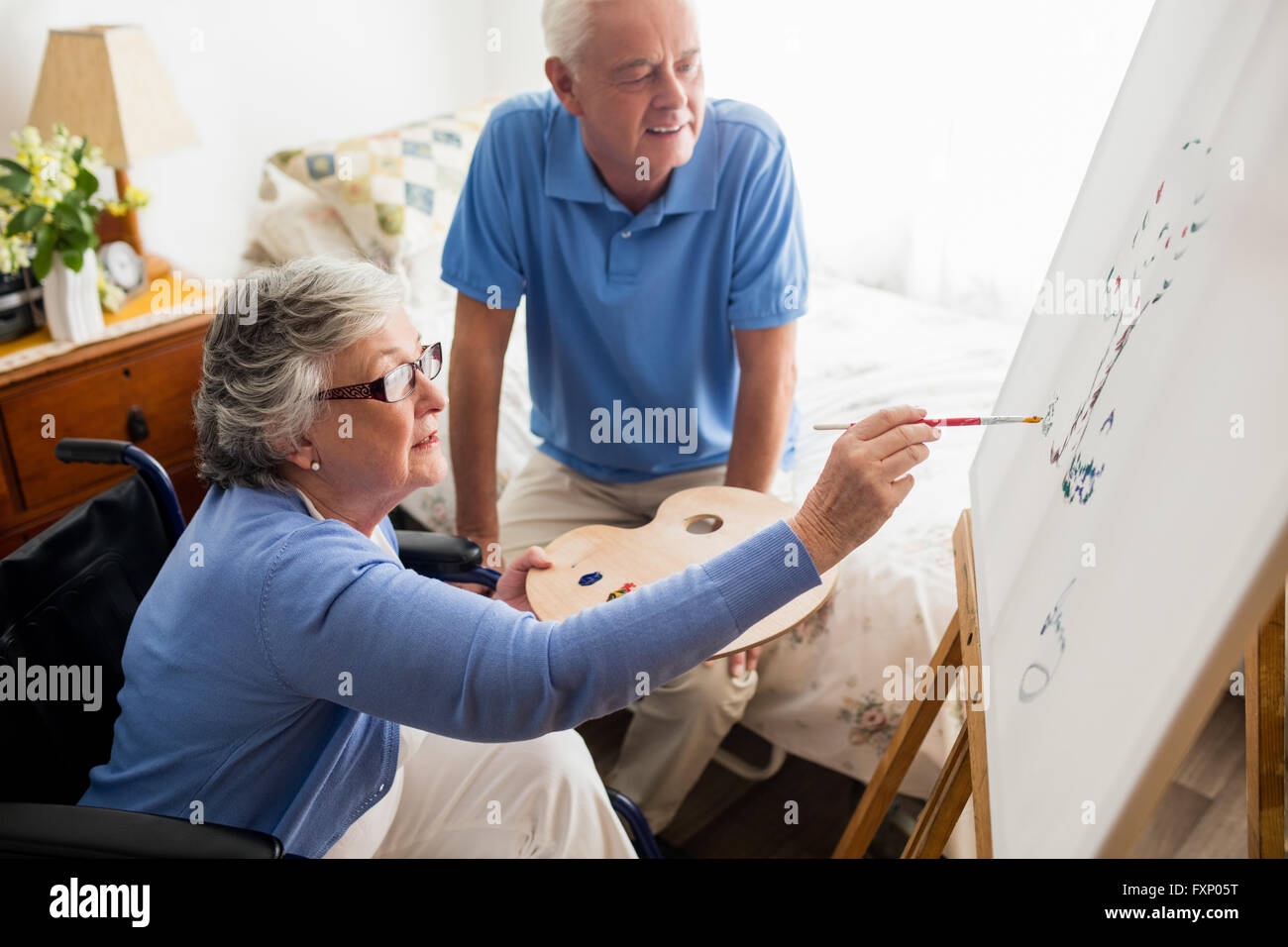 Senior couple painting in a retirement home Stock Photo - Alamy