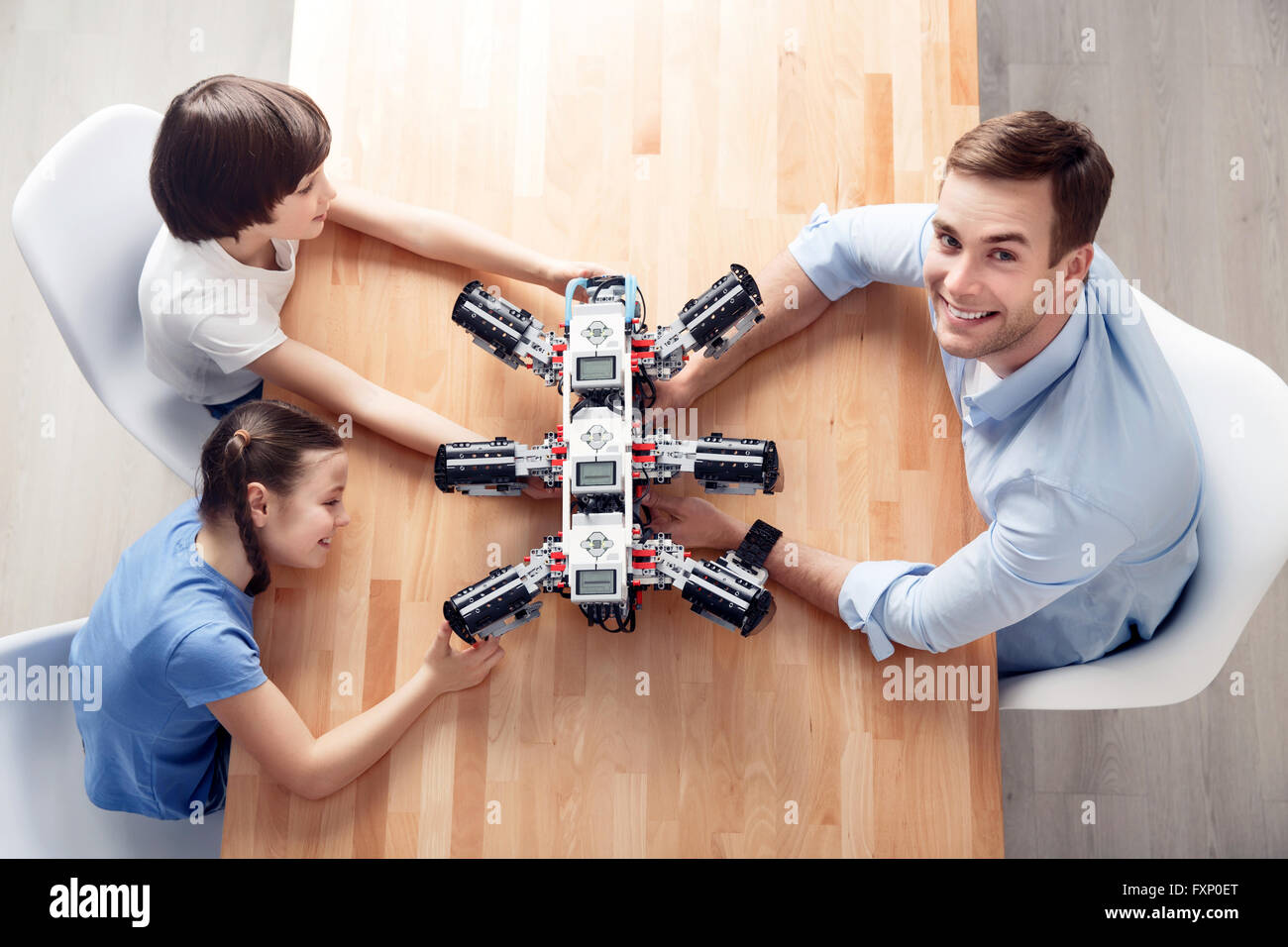 Positive father playing with kids Stock Photo - Alamy