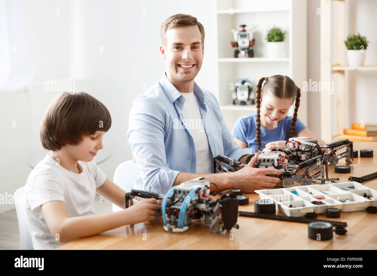 Positive father playing with kids Stock Photo - Alamy