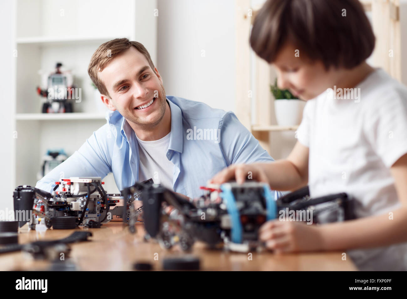Positive father playing with kids Stock Photo - Alamy