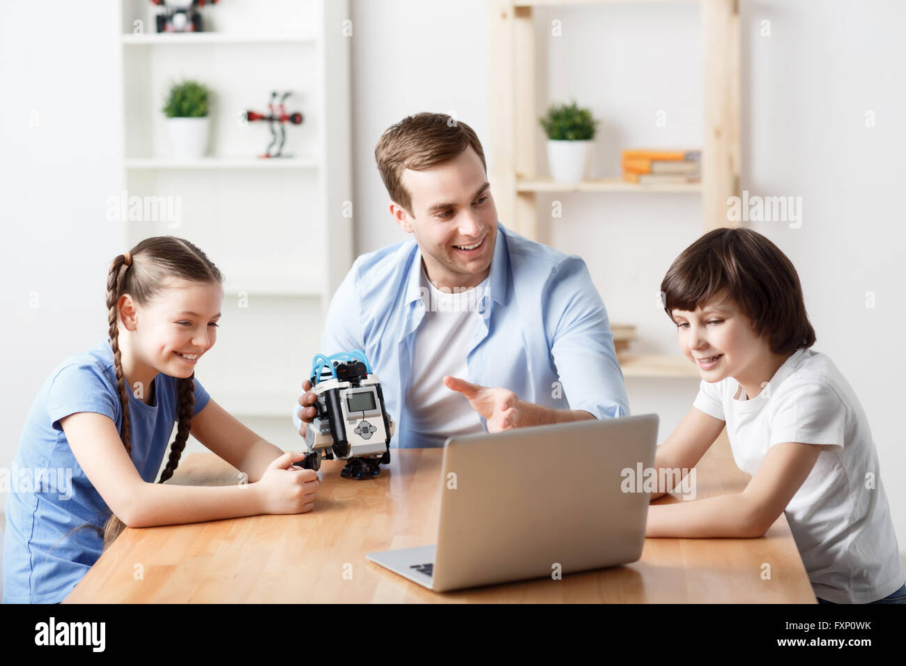 Positive father playing with kids Stock Photo - Alamy