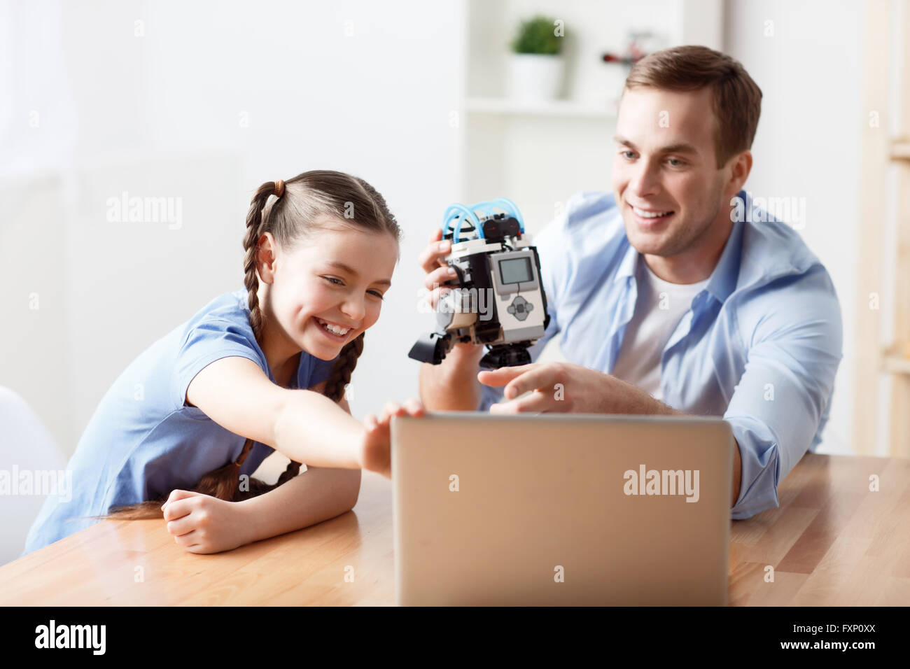 Positive father playing with his daughter Stock Photo - Alamy