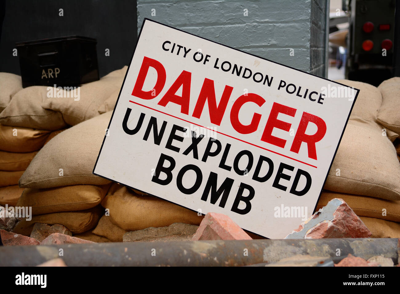 Danger Unexploded Bomb sign at Imperial War Museum, Duxford, UK Stock ...
