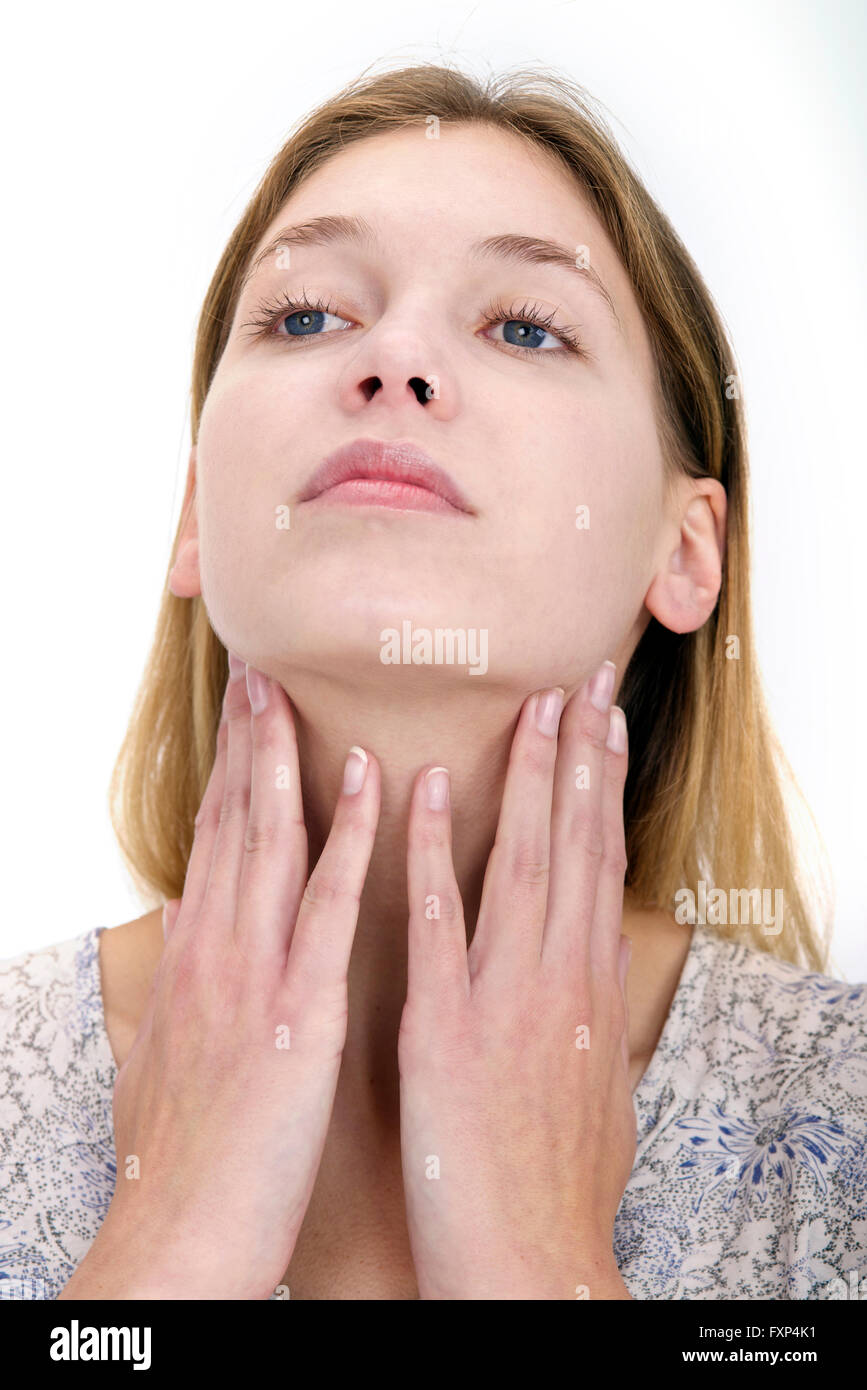 Woman touching her neck hi-res stock photography and images - Alamy