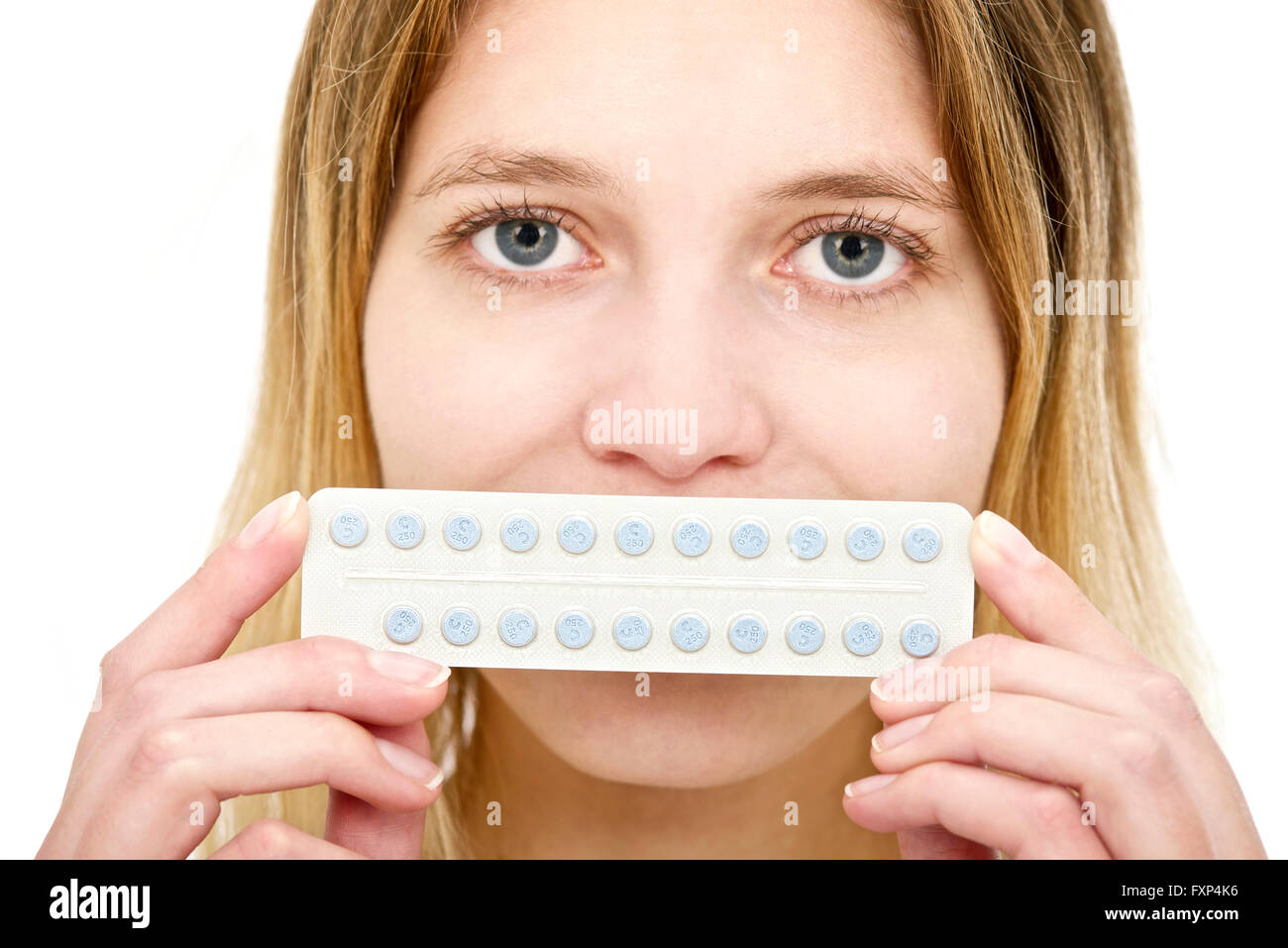 MODEL RELEASED. Young woman holding contraceptive pills Stock Photo - Alamy