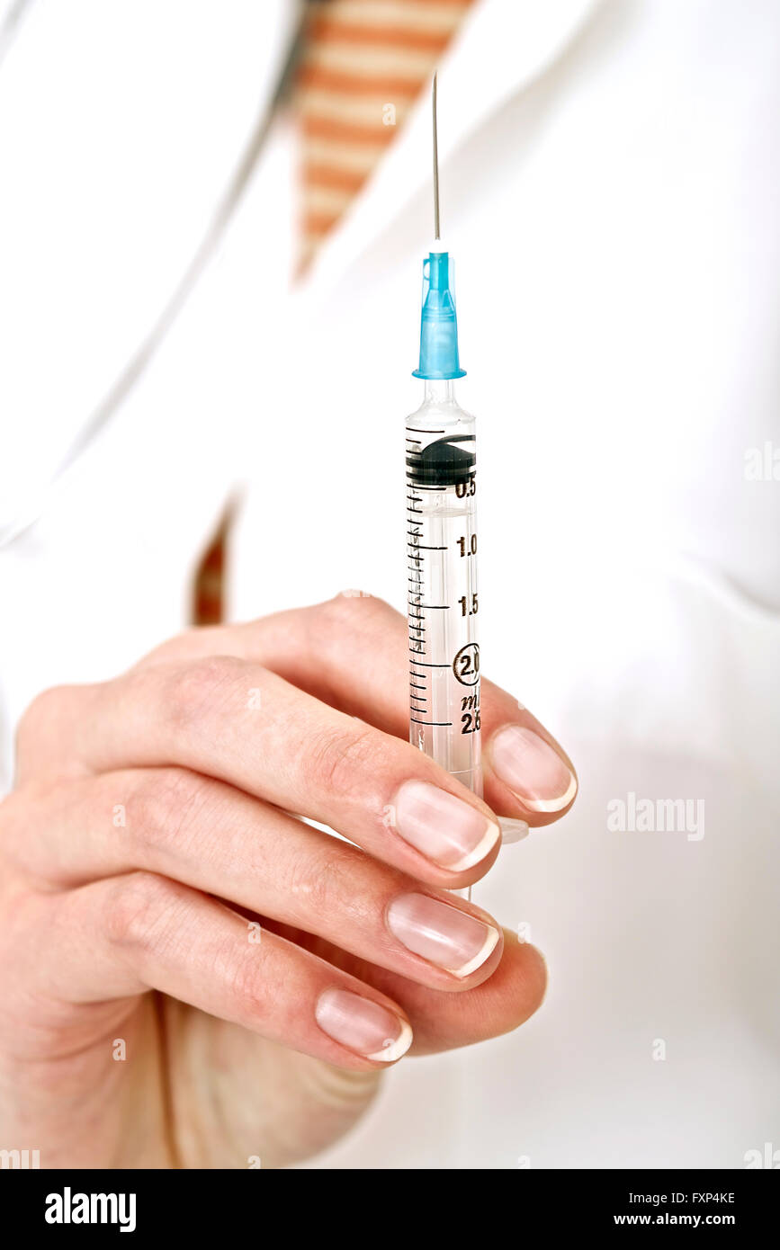 Female model holding injection hi-res stock photography and images - Alamy