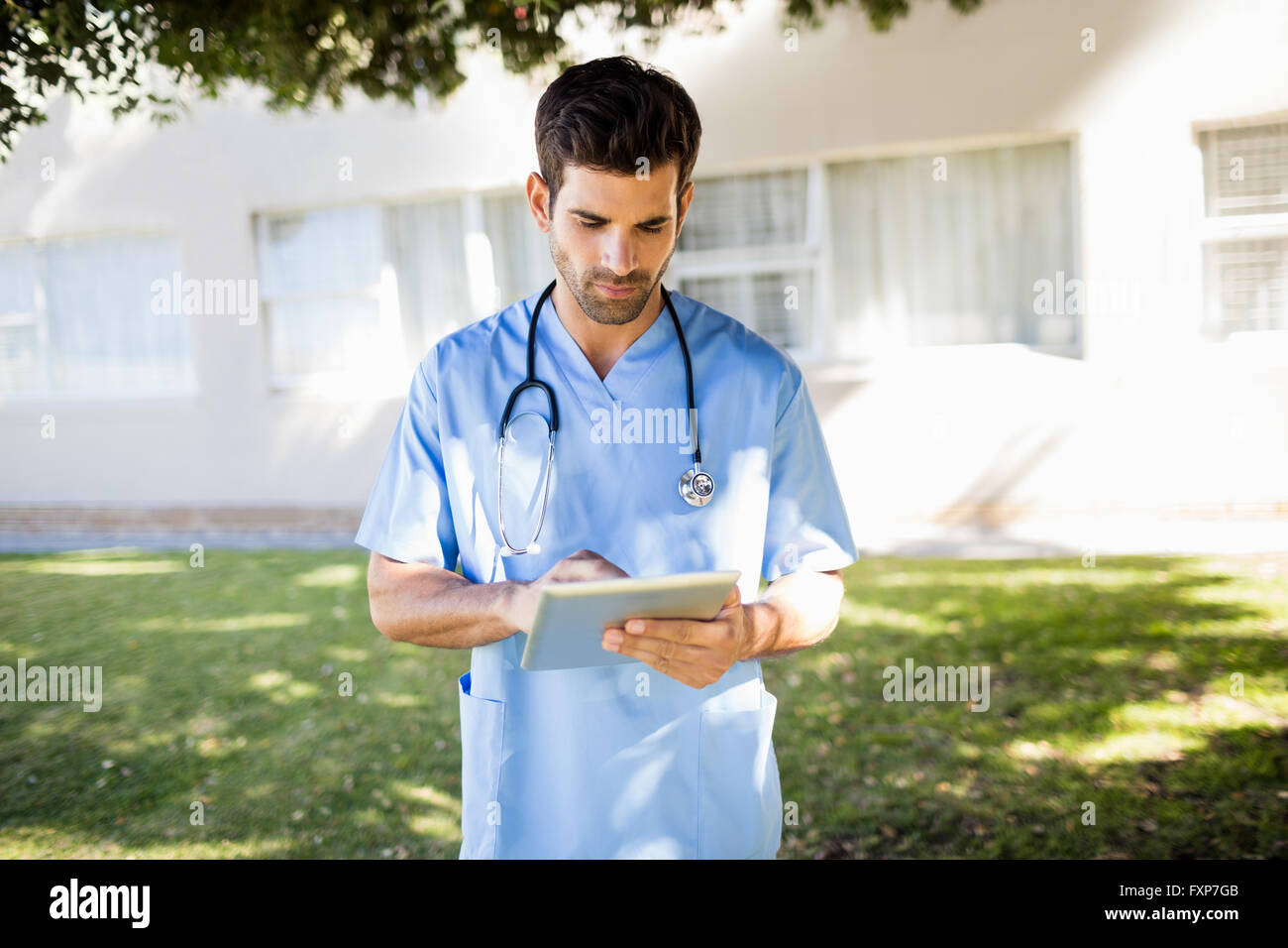 Nurse reading his notebook Stock Photo - Alamy