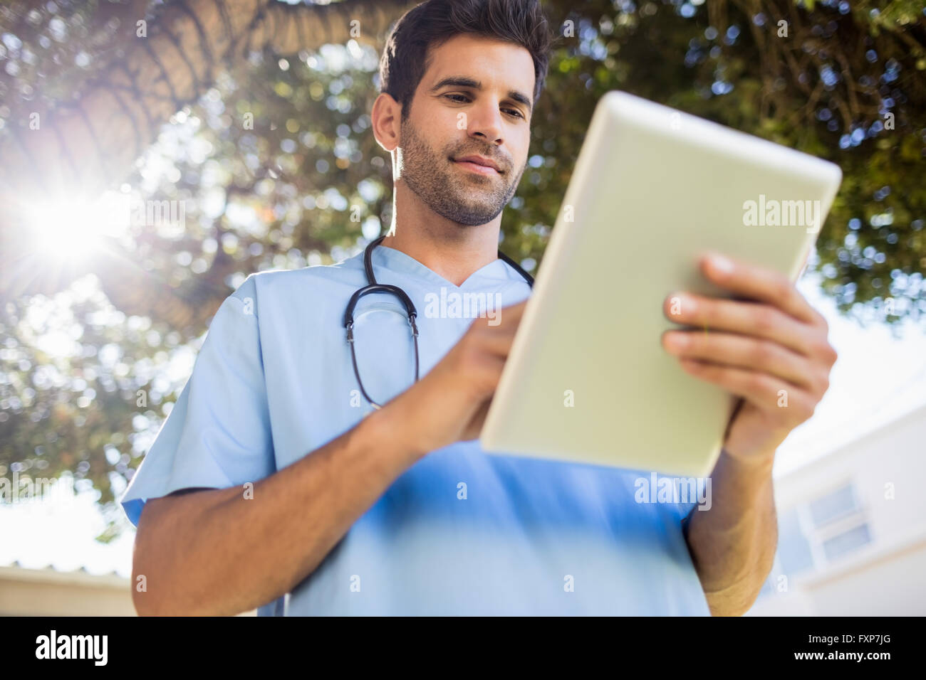 Nurse reading his notebook Stock Photo - Alamy
