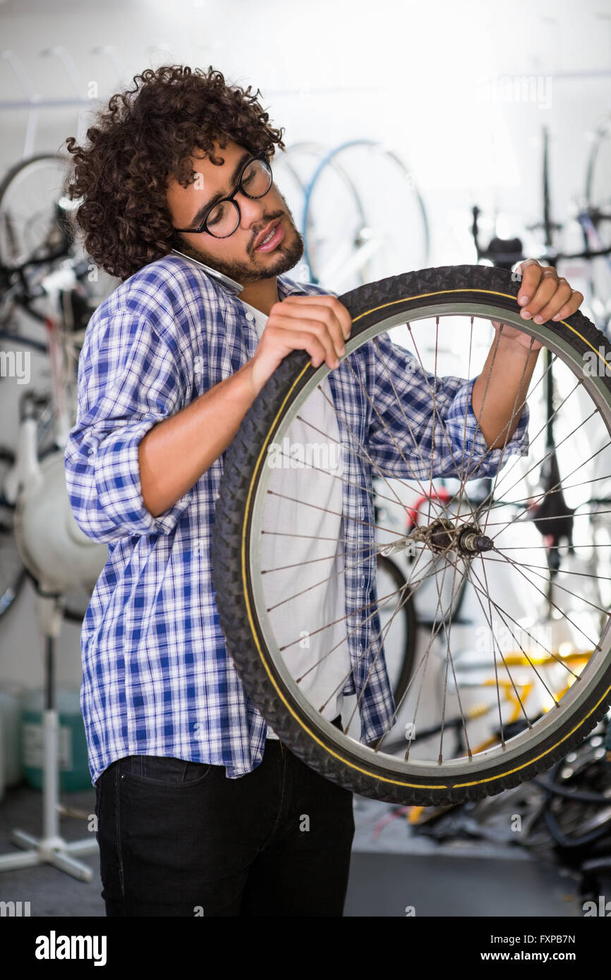 Worker using phone repairing hi-res stock photography and images - Alamy