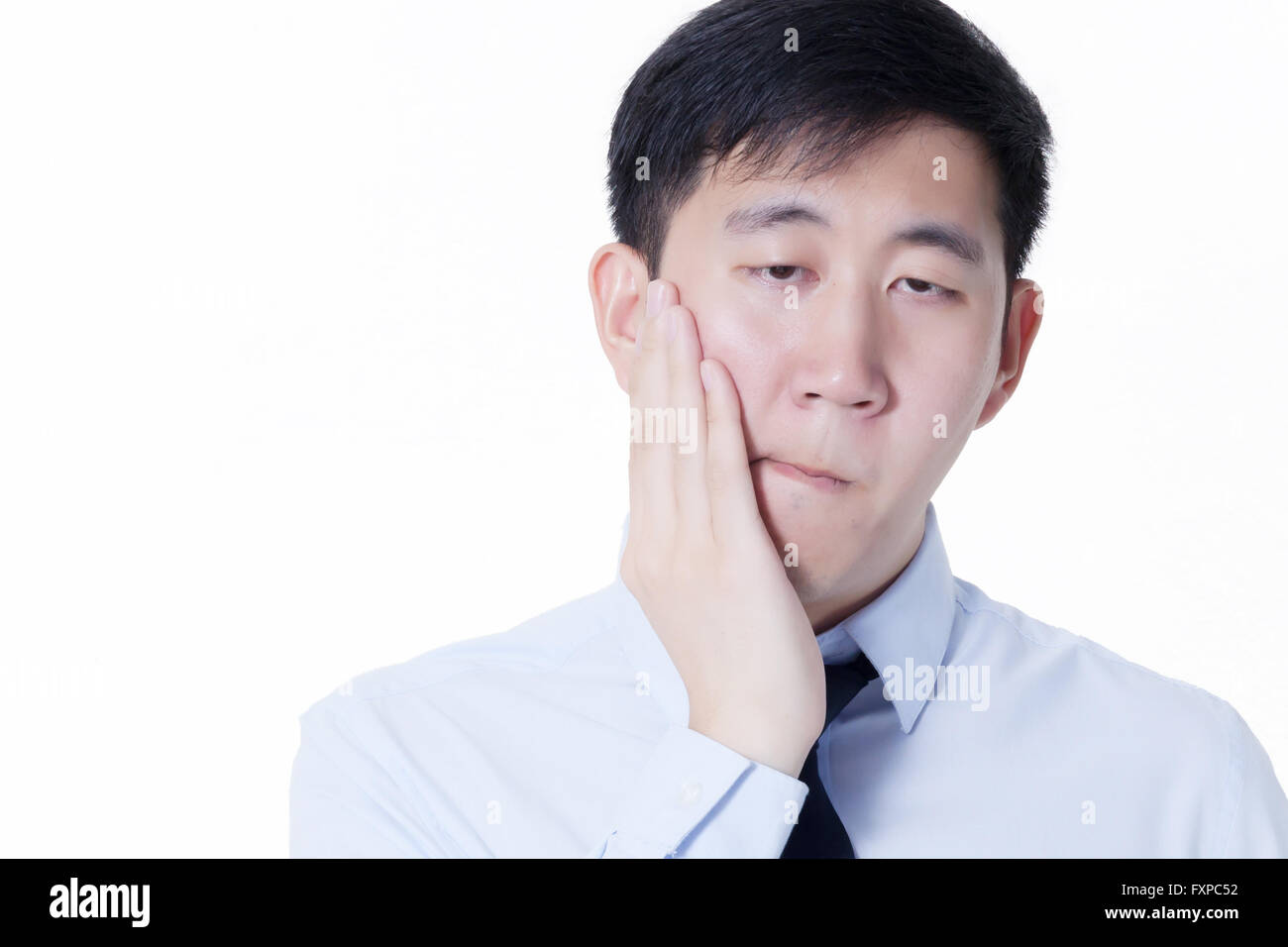 Young Asian man suffering from toothache / mouth problems Stock Photo ...