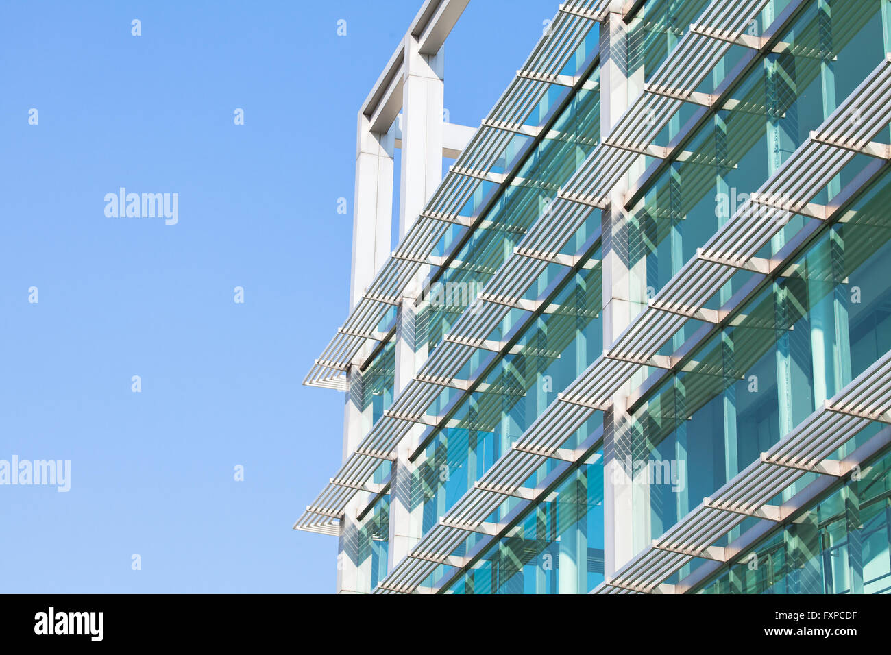 Close-up of glass building with windows reflected to the sky Stock ...