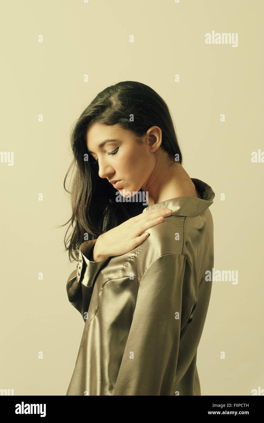 Beautiful young woman hand touching shoulder Stock Photo - Alamy