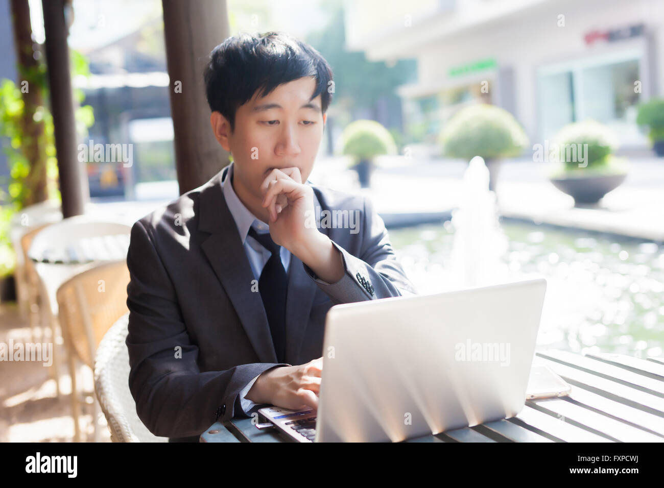 Face happy japanese businessman thinking hi-res stock photography and ...