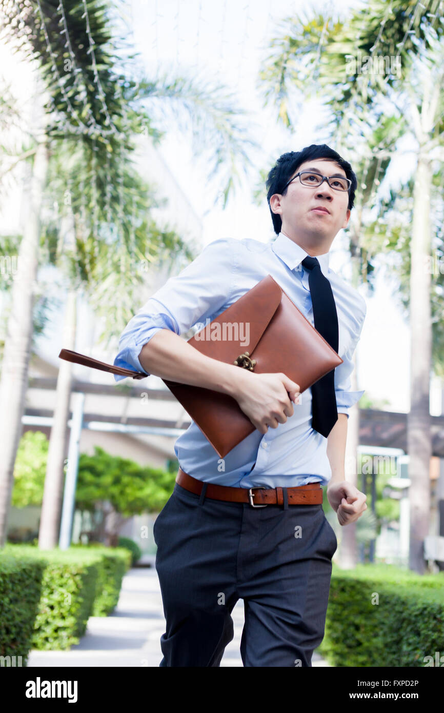 Young Business Asian exhausted man running late for work Stock Photo ...