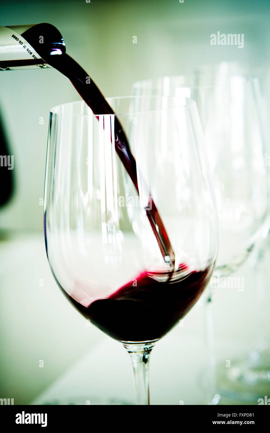 Pouring red wine Stock Photo - Alamy