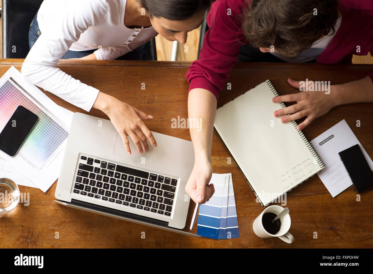 Team members collaborating on project Stock Photo - Alamy