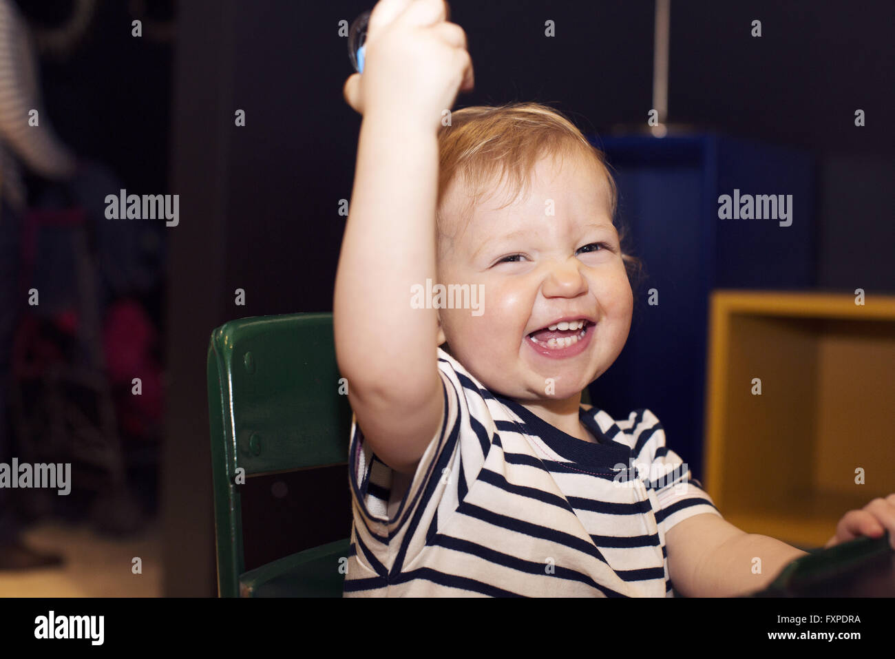 Laughing baby raising hand hi-res stock photography and images - Alamy