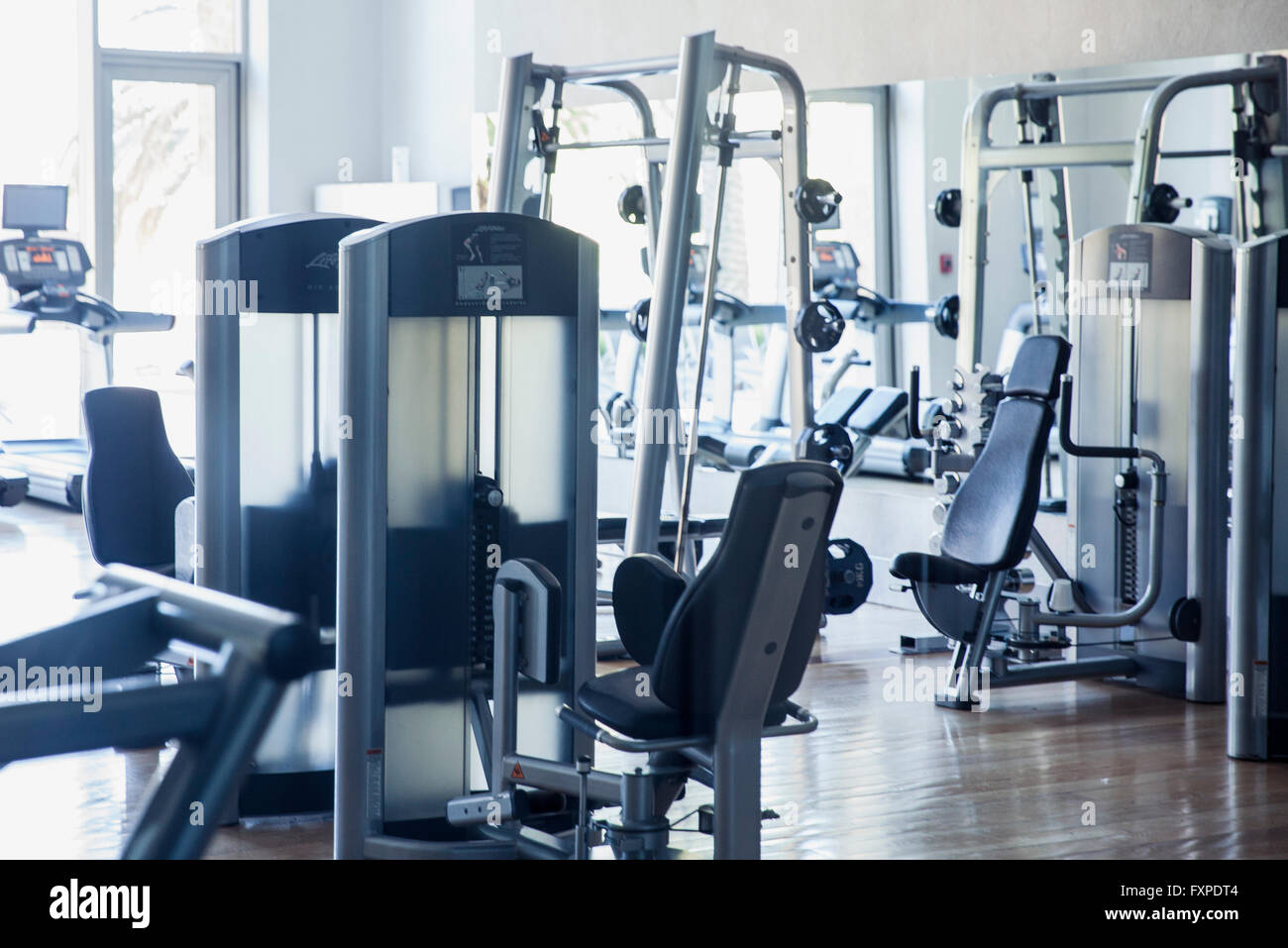 Empty weight room in health club Stock Photo - Alamy