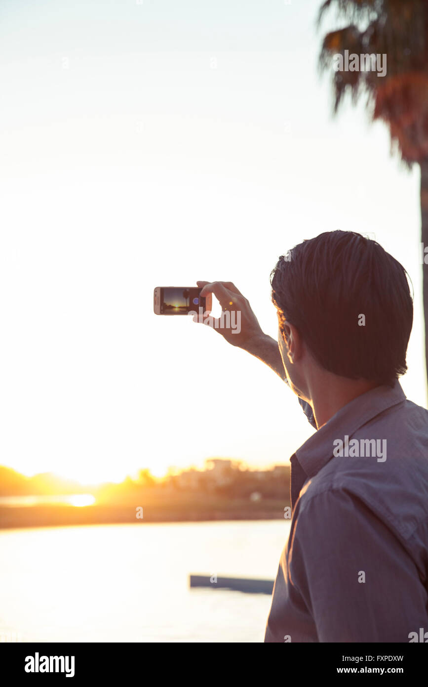 Silhouettes tourists photographing tourist hi-res stock photography and ...