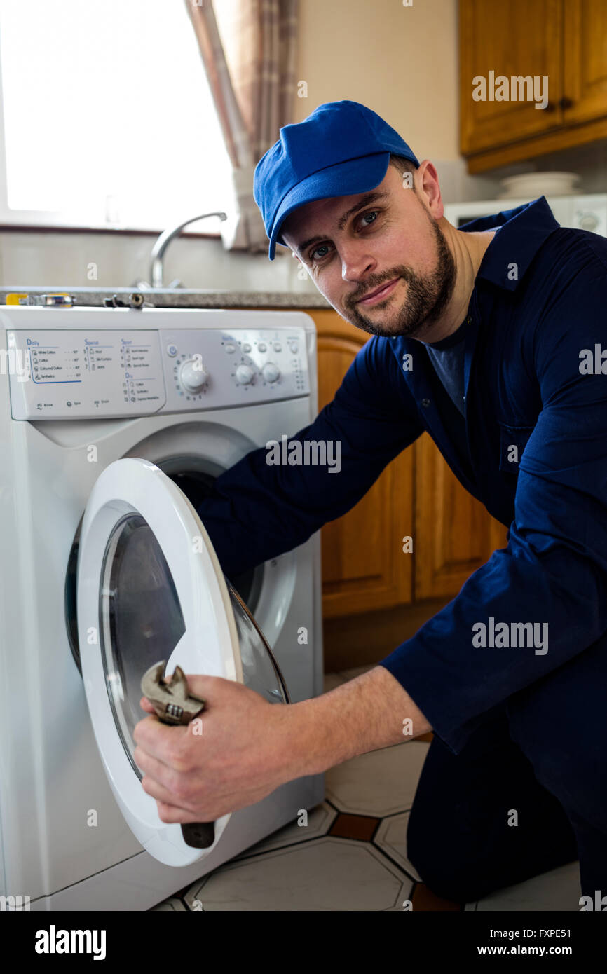 Man Fixing Washing Machine High Resolution Stock Photography and Images ...
