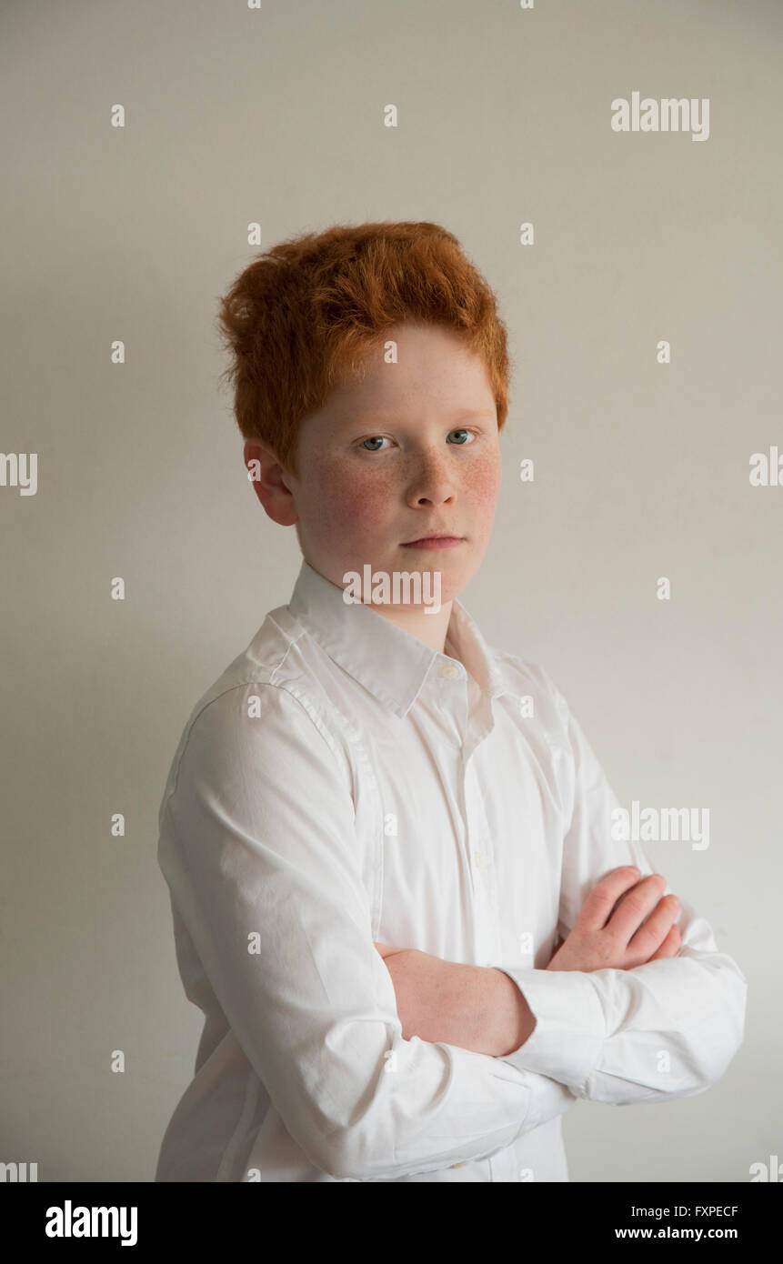 Boy with arms folded, portrait Stock Photo - Alamy